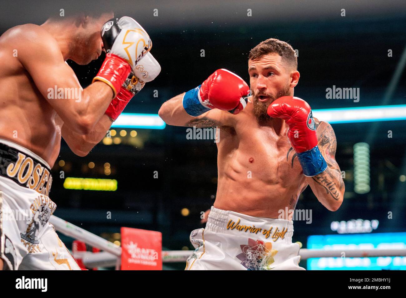 Cody Crowley, right, from Canada, trades punches with Josetito Lopez ...