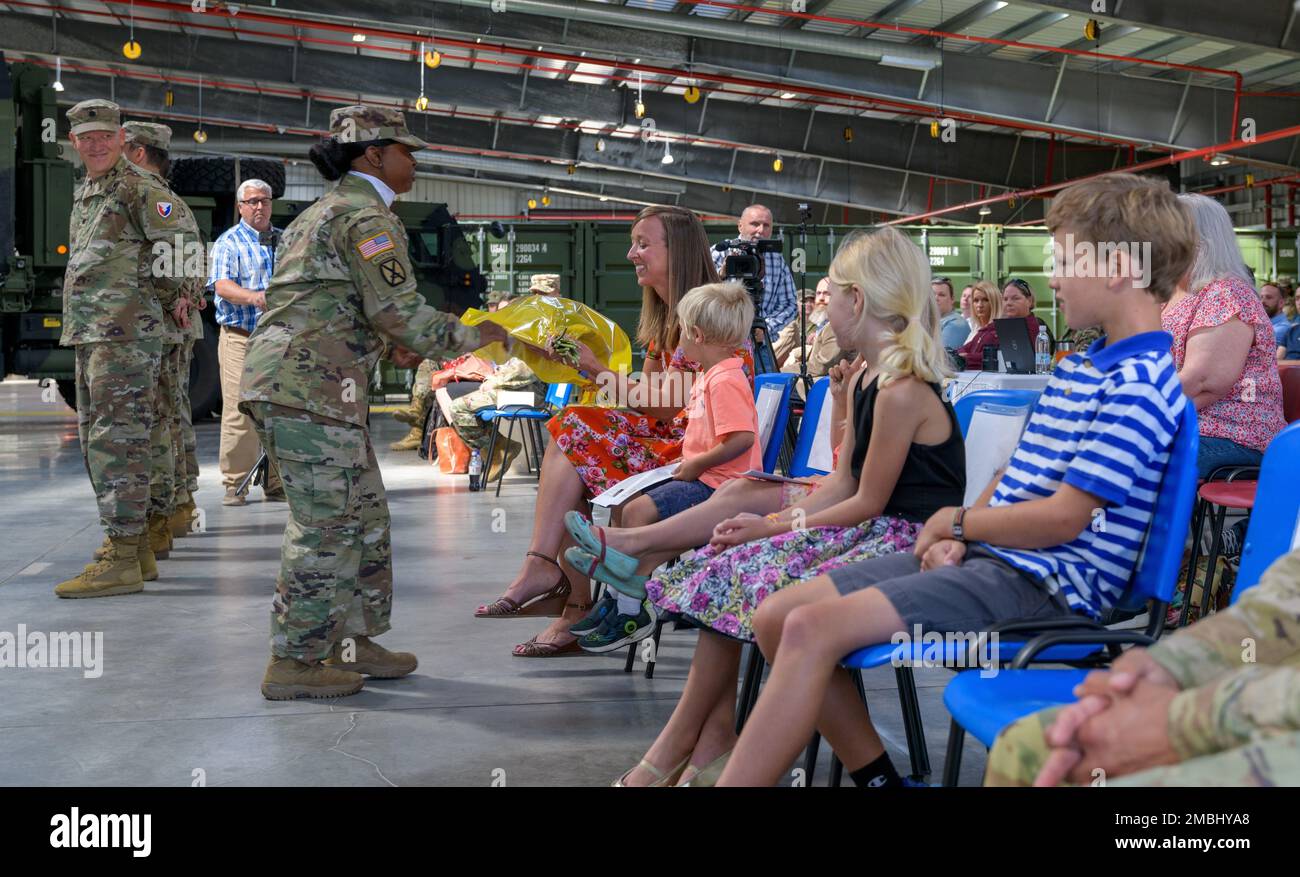 Katie Smith, spouse of Lt. Col. Blake Smith, receives a bouquet of ...