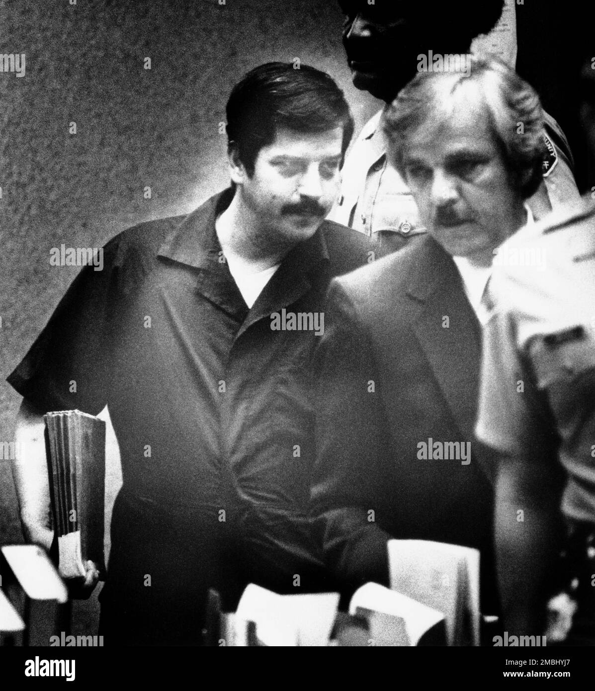 William G. Bonin, left, follows his attorney William Charvet into the ...