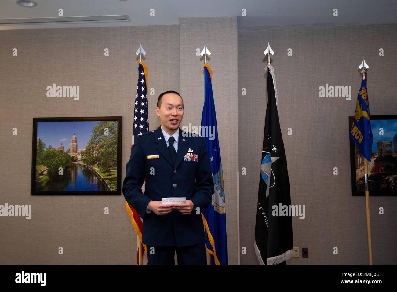 U.S. Air Force Lt. Col. Alan Louie addresses the audience as the new ...