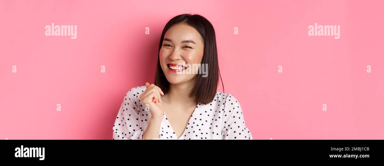 Beauty and lifestyle concept. Close-up of happy asian female laughing ...