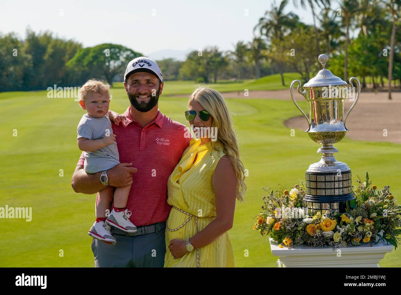 Jon Rahm, of Spain, poses for photos with his wife Kelley Cahill and ...