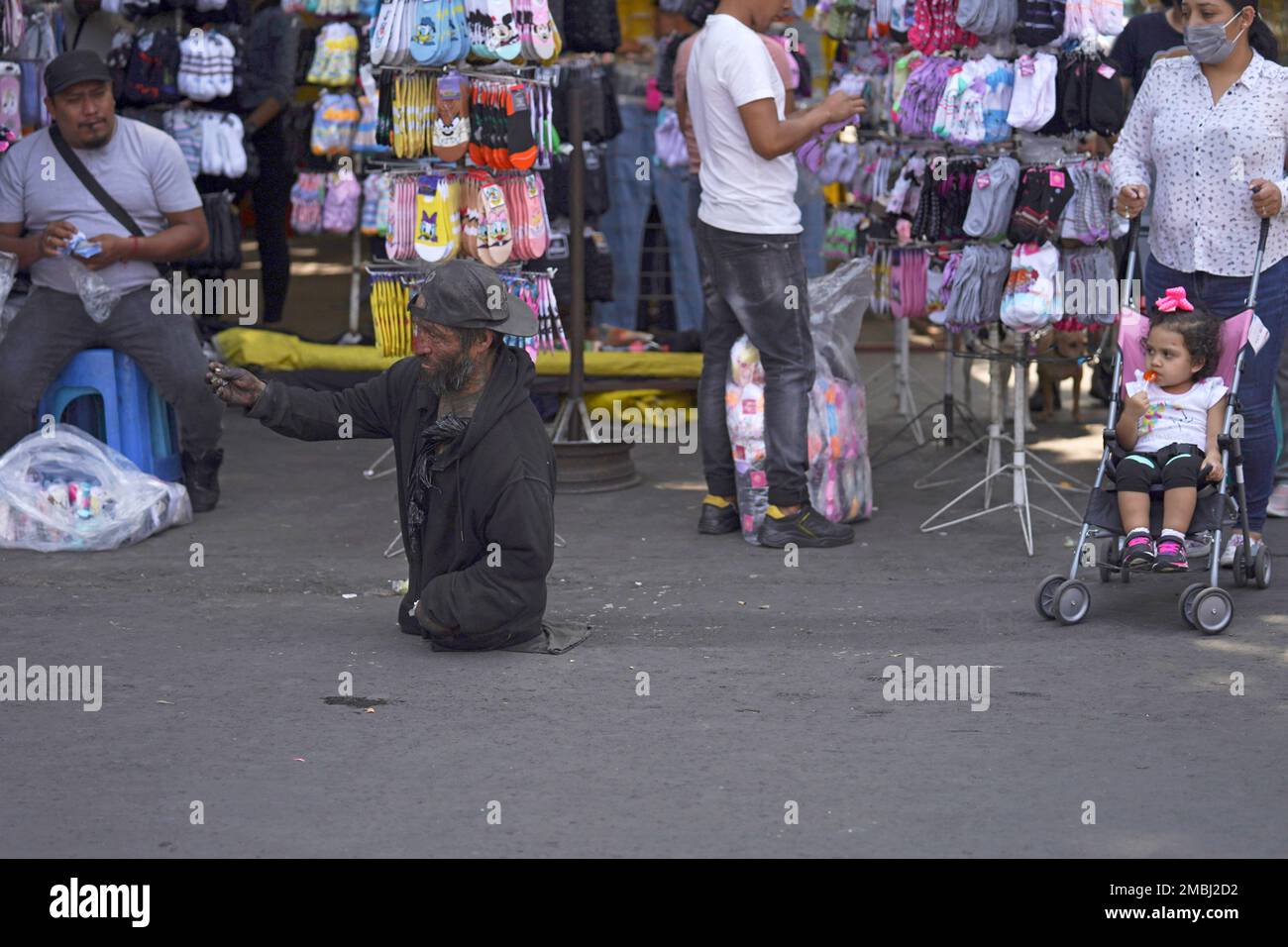 A legless man begs for alms during a march to commemorate International ...