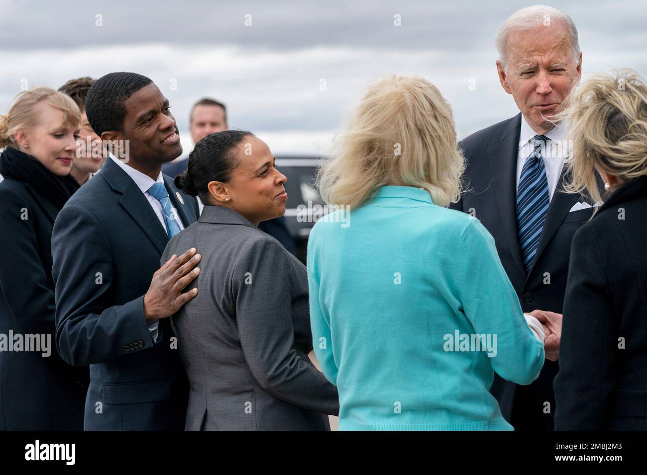 President Joe Biden, right, is greeted by, from left, Melvin Carter ...