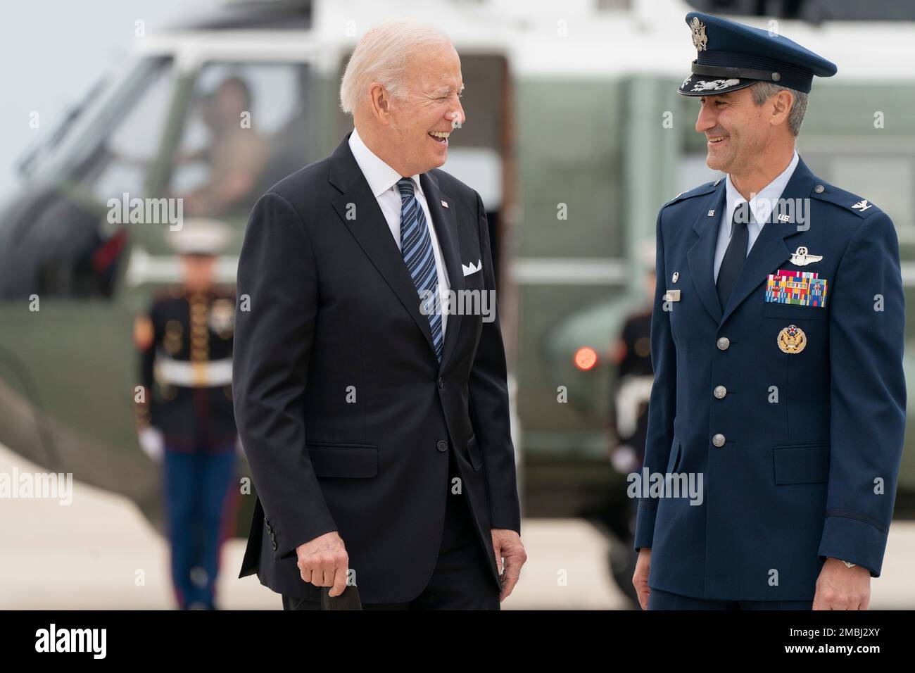 President Joe Biden walks with Col. Matt Getty, Commander, 89th ...