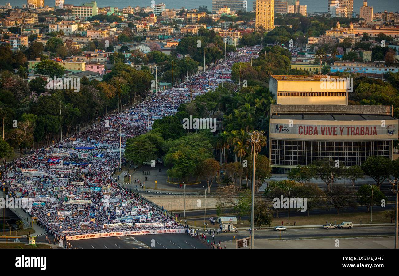 Thousands file through an avenue during a May Day march to Revolution ...