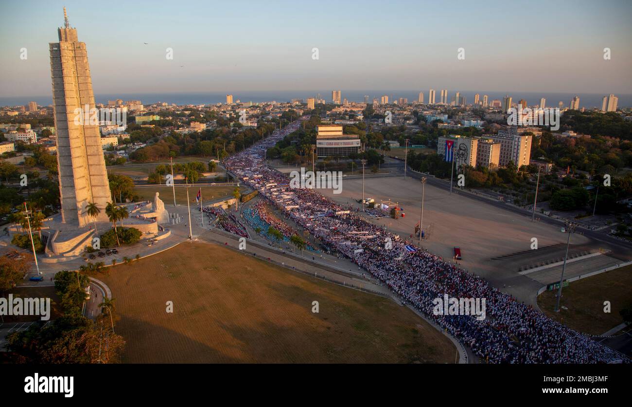 Thousands file through an avenue during a May Day march to Revolution ...
