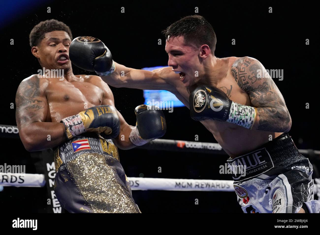 Oscar Valdez, right, throws a right at Shakur Stevenson during a WBC-WBO junior lightweight ...