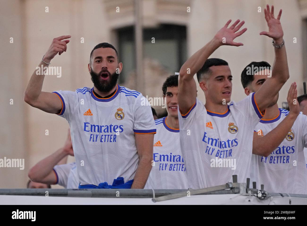Real Madrid's Karim Benzema, left, joins in celebrations after Real ...