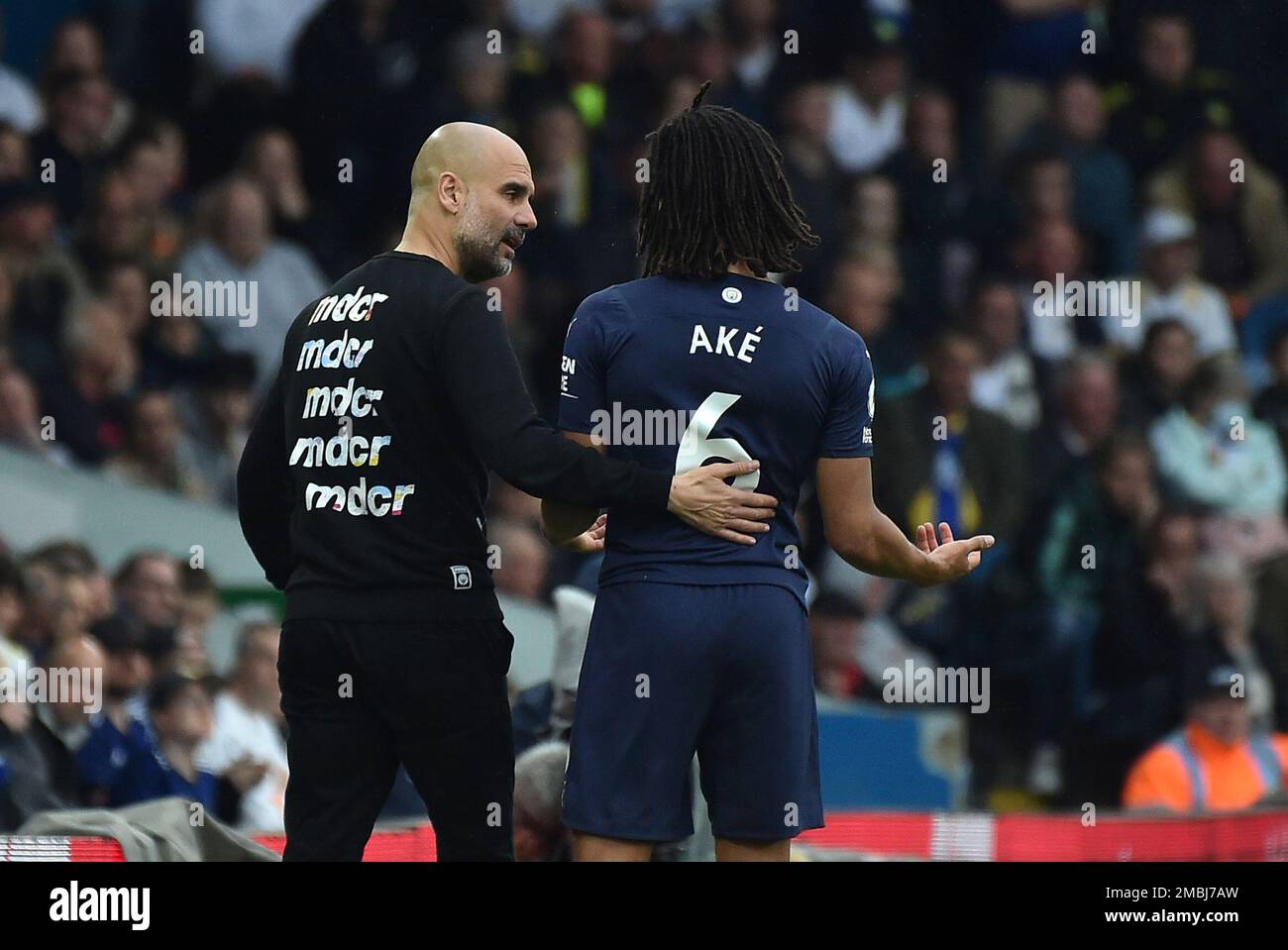 Manchester City's head coach Pep Guardiola, left, and Manchester City's ...