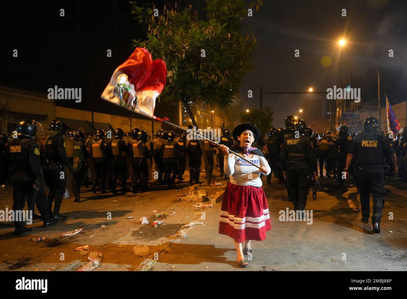 A woman waves a Peruvian flag during an anti-government protest in Lima ...
