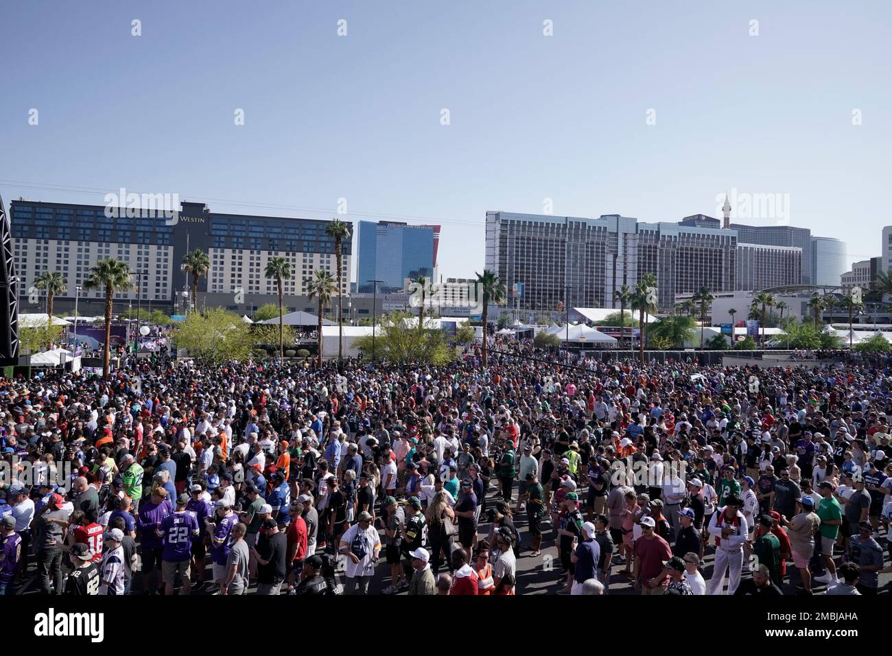The crowd attending the second round of the NFL football draft is shown ...