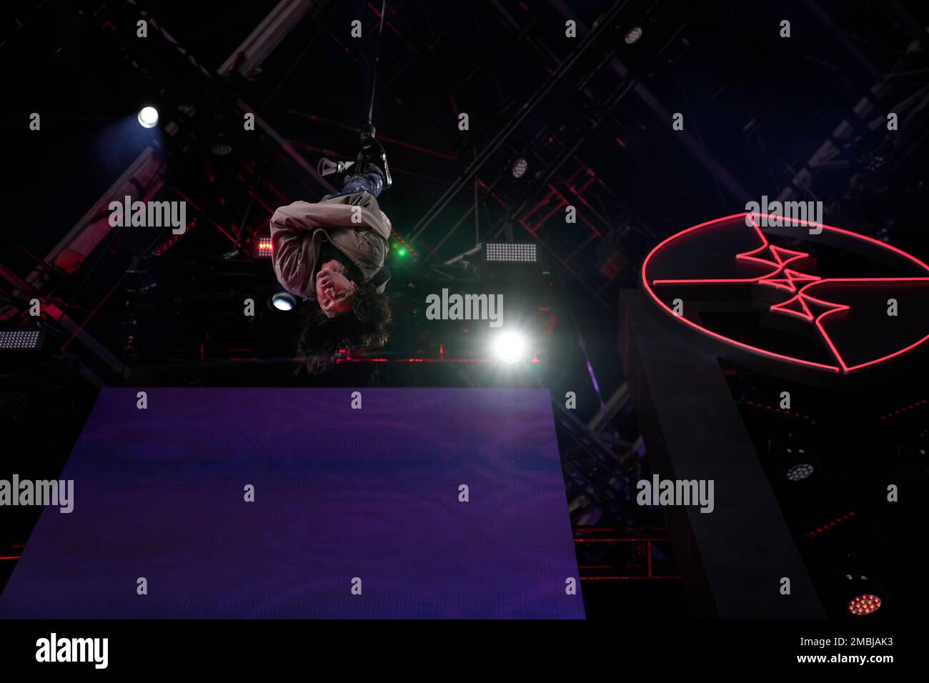 Magician Criss Angel performs a stunt before the second round of the ...