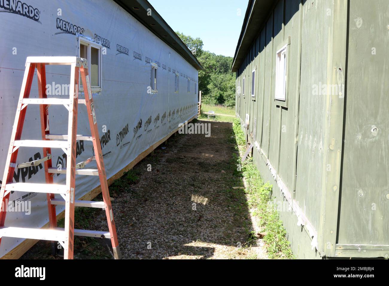 Two buildings stand in contrast as engineers from the 389th Engineer ...