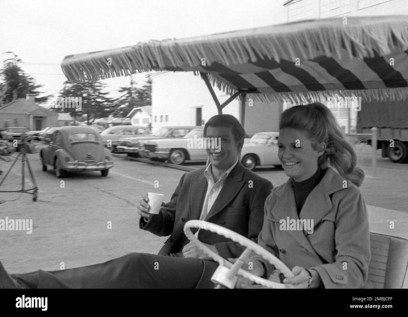 British actress Carol White seems to be having fun, driving along the ...