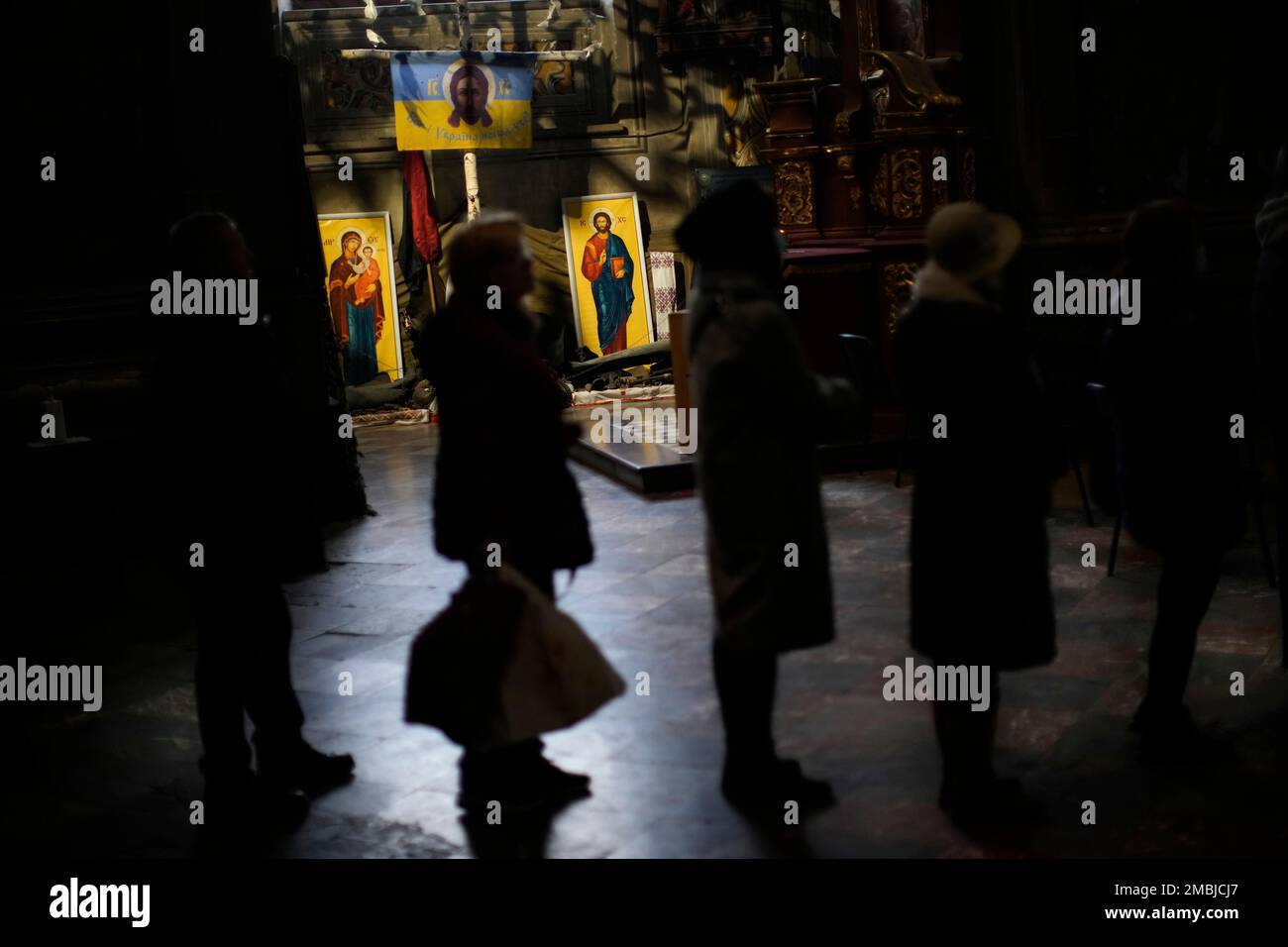 Worshippers wait in line to kiss what represents the coffin of Jesus ...