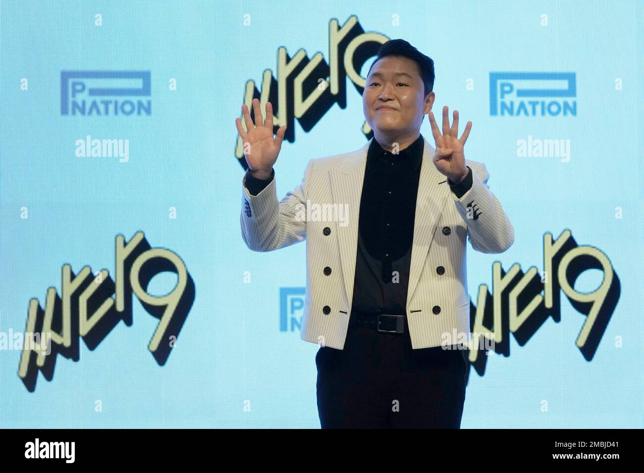 South Korean singer PSY poses for a photo during a press conference to ...