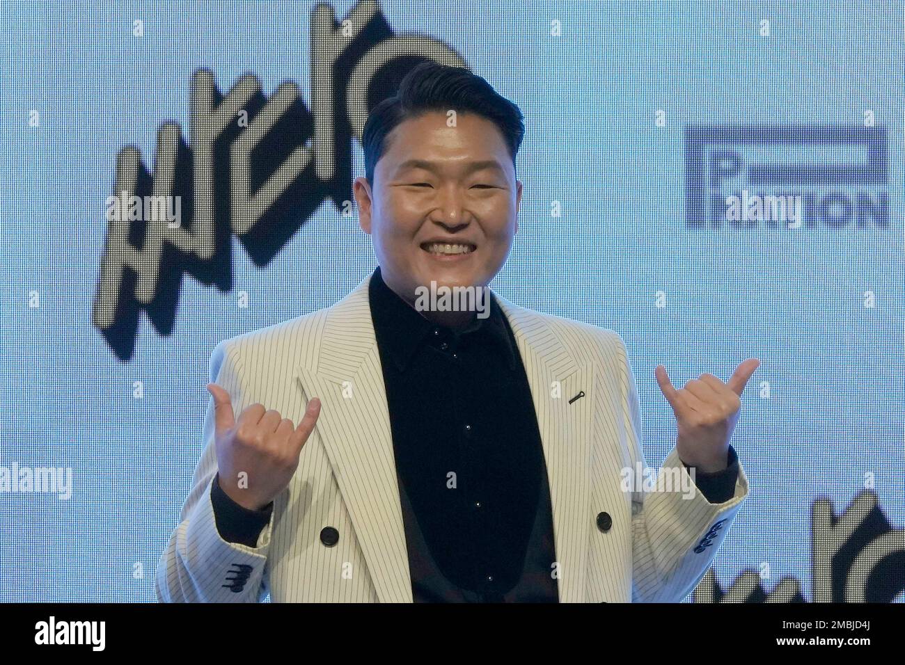 South Korean singer PSY poses for a photo during a press conference to ...
