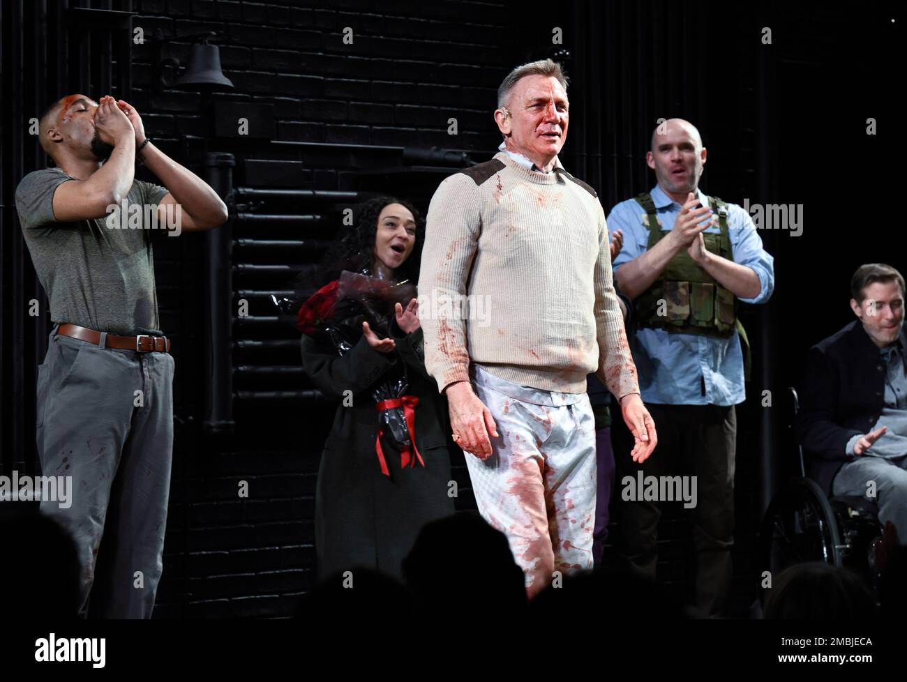 Actor Daniel Craig, center, participates in the curtain call during the ...