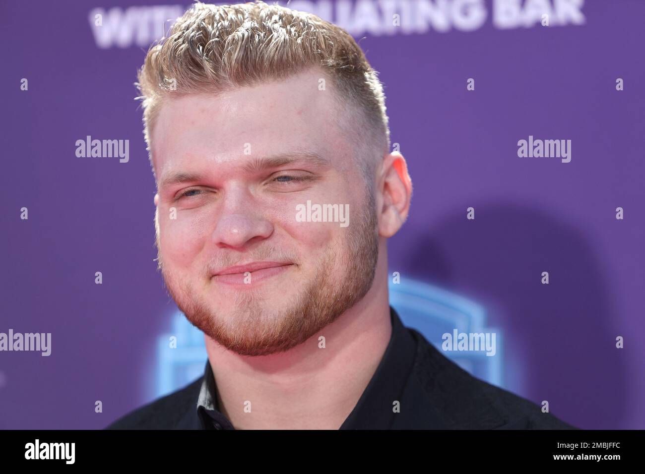 Michigan defensive end Aidan Hutchinson arrives on the red carpet ...