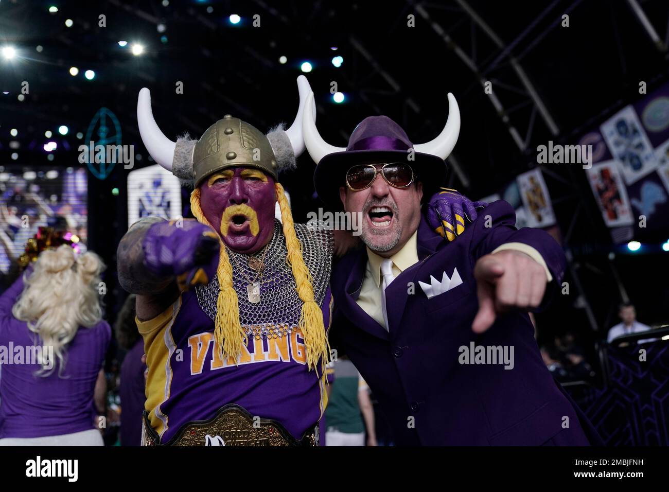Minnesota Viking fans wear costumes during the first round of the NFL ...