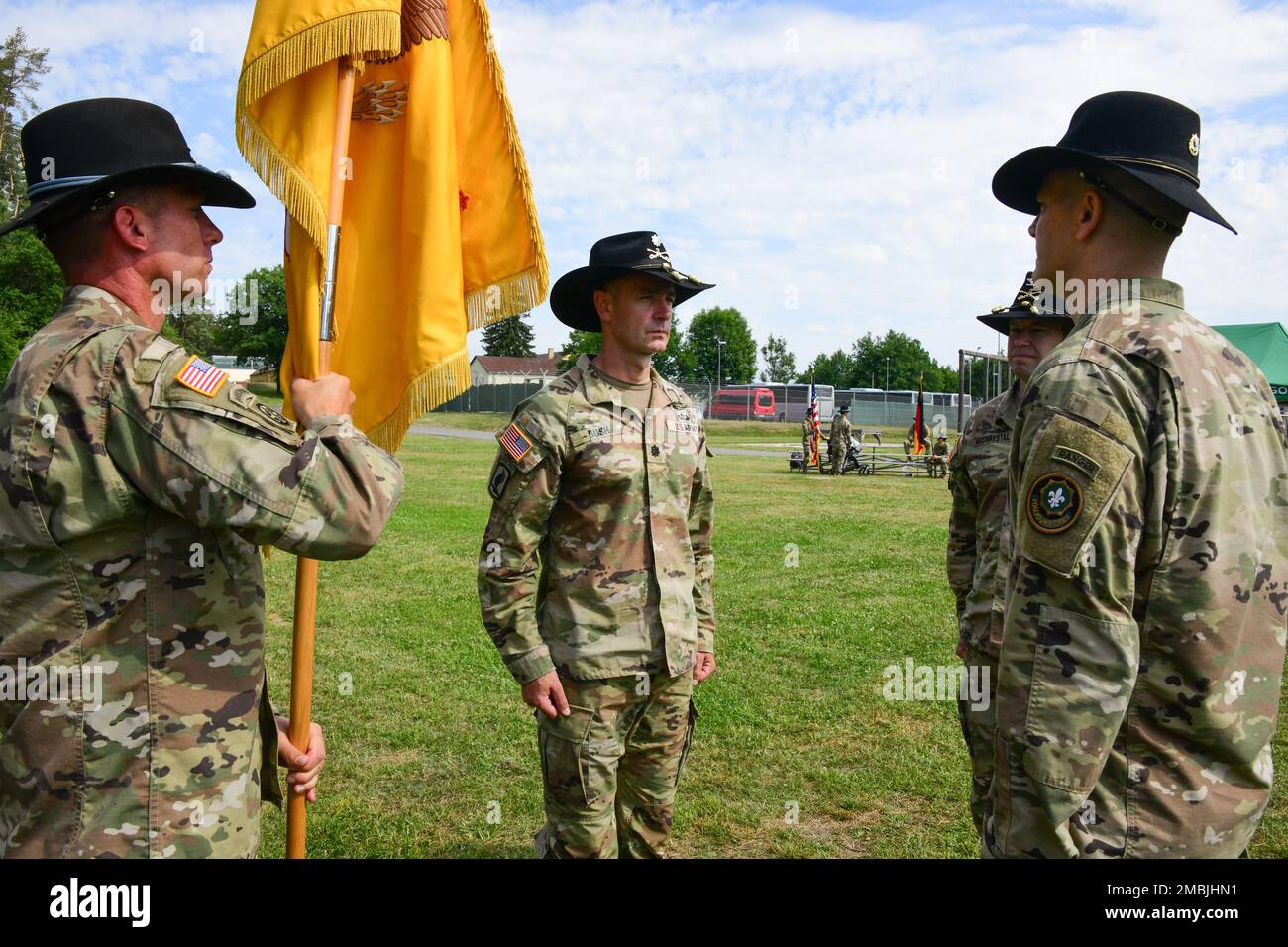 Command Sgt. Maj. Christopher Carbone passes the squadron colors to Lt ...