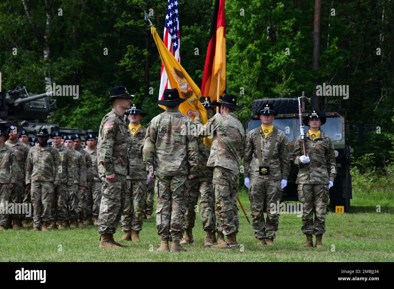 Command Sgt. Maj. Christopher Carbone passes the squadron colors to Lt ...