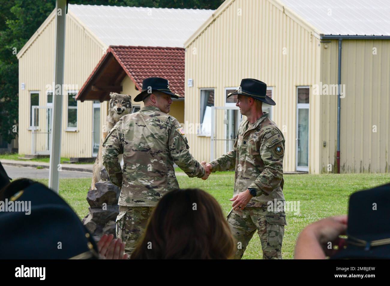 Lt. Col Mark Bush and Lt. Col. Peter Erickson shake hands as both cross ...