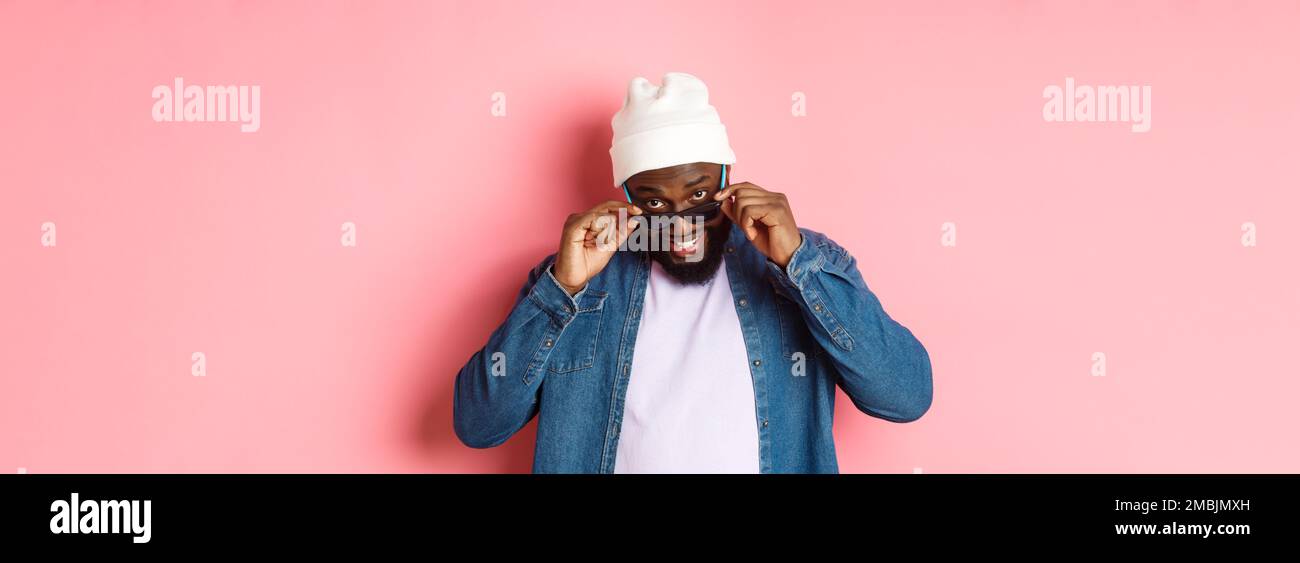 Confused african-american guy stare at camera, take-off sunglasses an ...