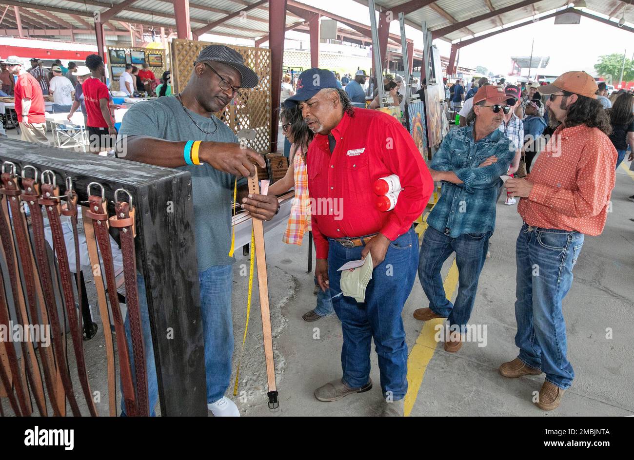 Angola Prison inmate Eldridge Stewart, left measures out a handcrafted ...
