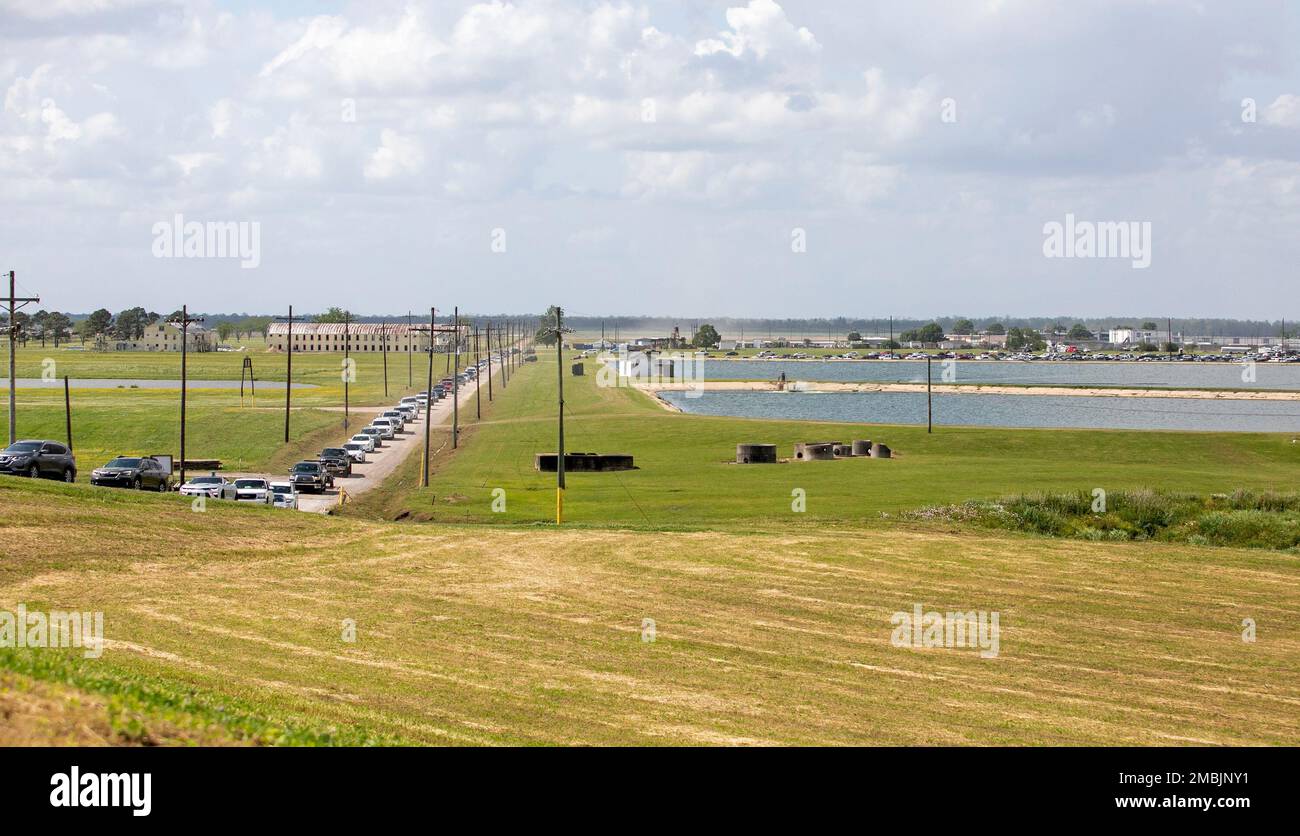 Vehicles head to the exits along the Mississippi River levee road at ...