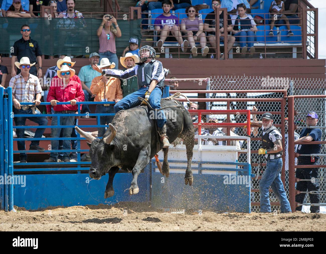 An inmate tries to hold on during the "bull riding" event during the ...