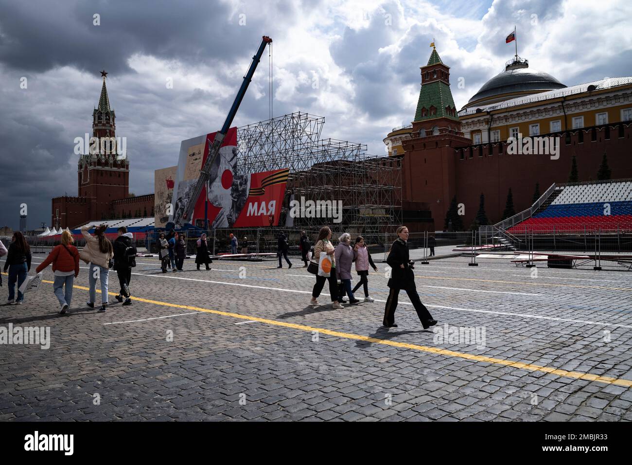 People walk in Red Square where municipal workers install decorations ...