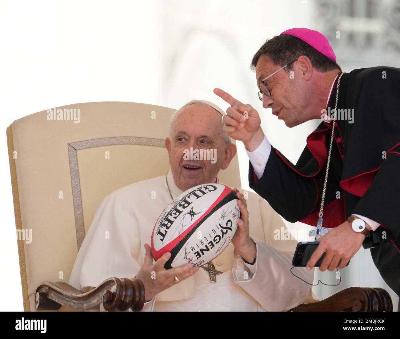 Pope Francis is presented with a rugby ball by bishop Emmanuel ...