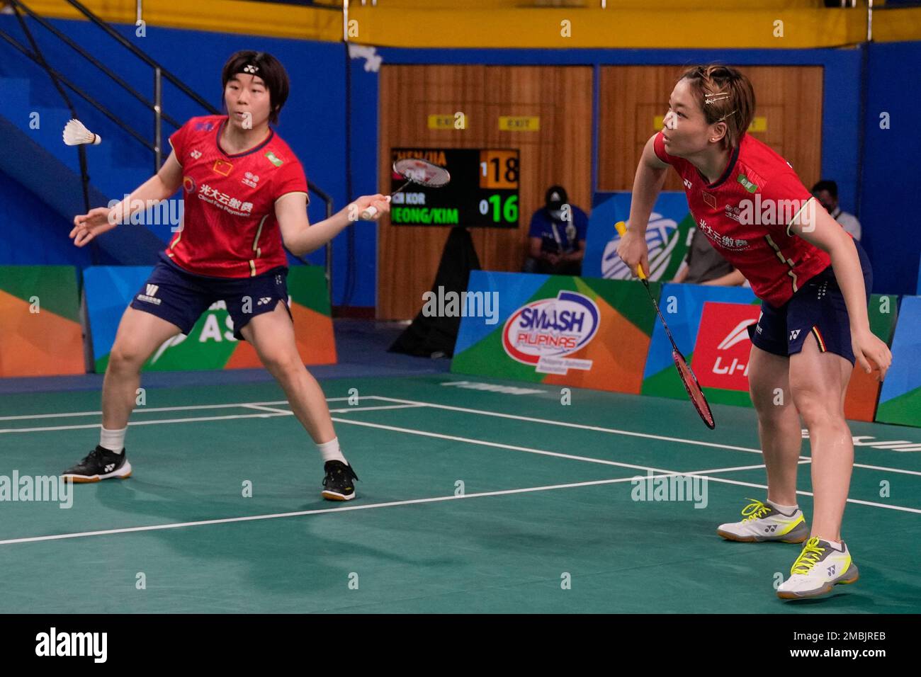 China's Jia Yi Fan, left, and Chen Qing Chen compete against South Korea's Na Eun Jeong, left ...