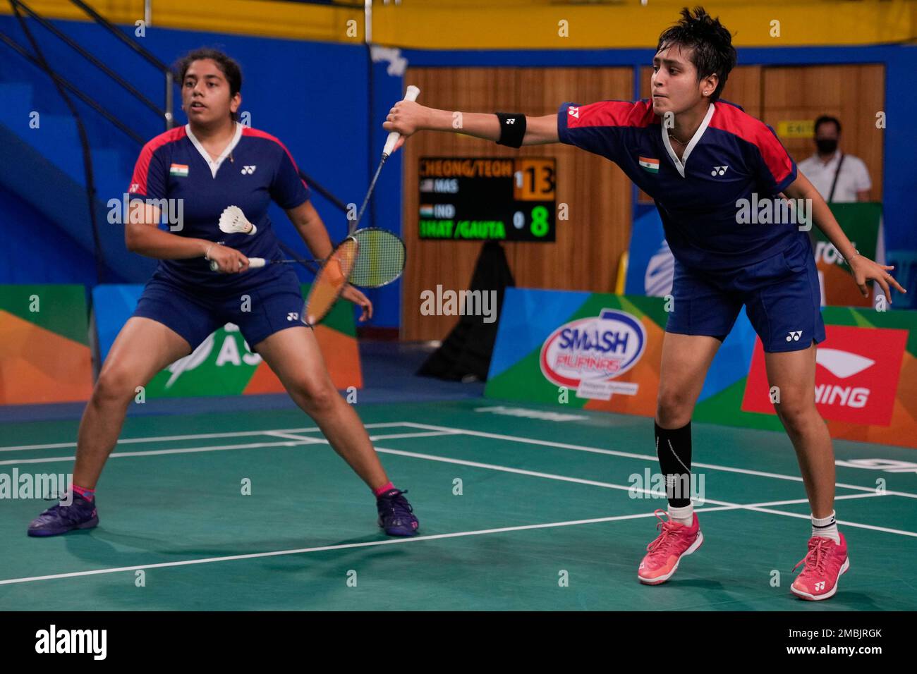 India's Shikha Gautam, right, and Ashwini Bhat competes against ...
