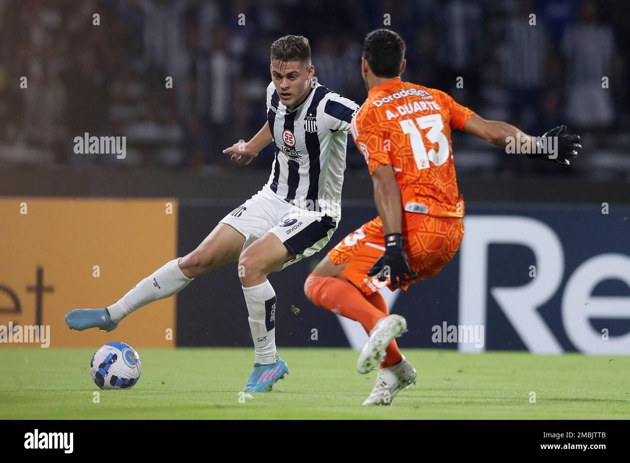 Federico Girotti of Argentina's Talleres, left, and goalkeeper ...