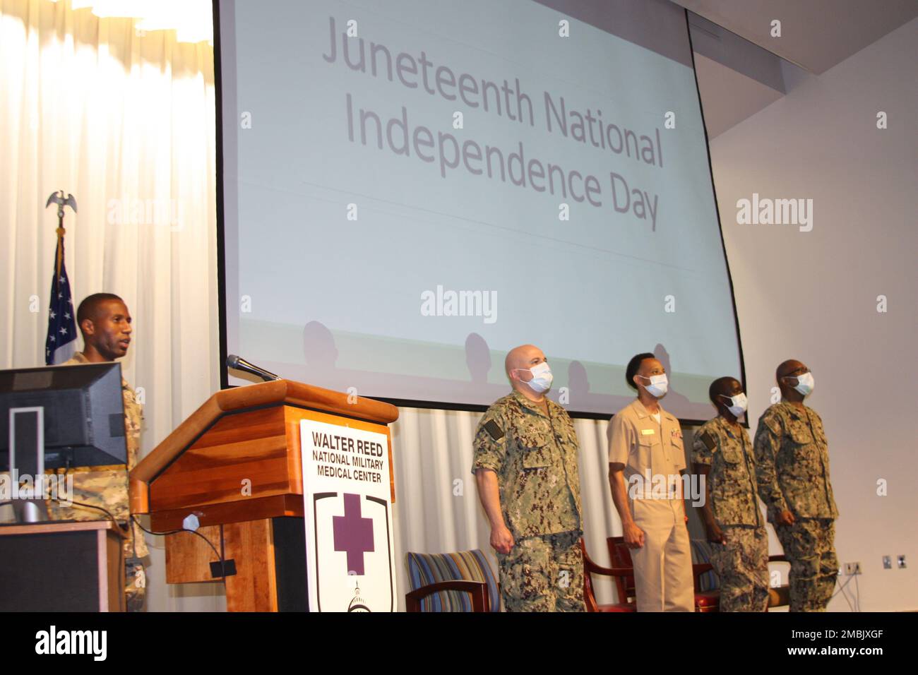 Army Sgt. Charles Mills Jr. (left) sings the national anthem to begin ...
