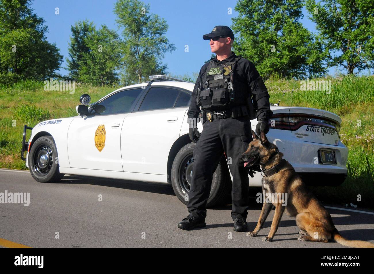 Kansas state trooper Lt. Justin Rohr and his K-9, Gizmo, prepare to ...