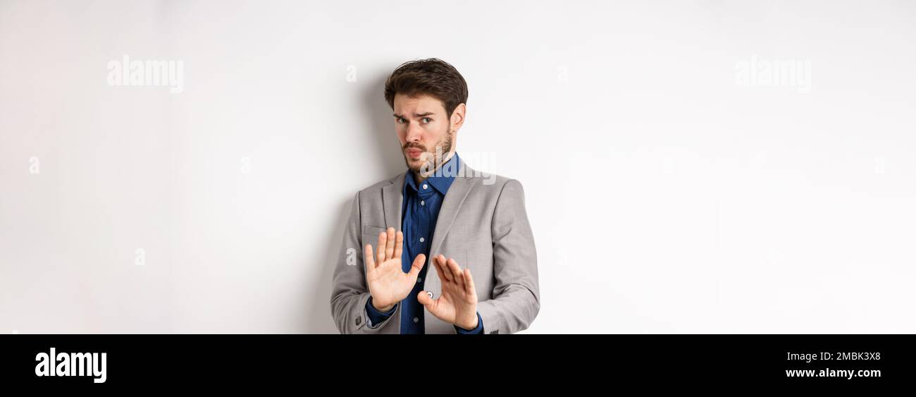 Stay away. Reluctant businessman step back with concerned disgusted ...