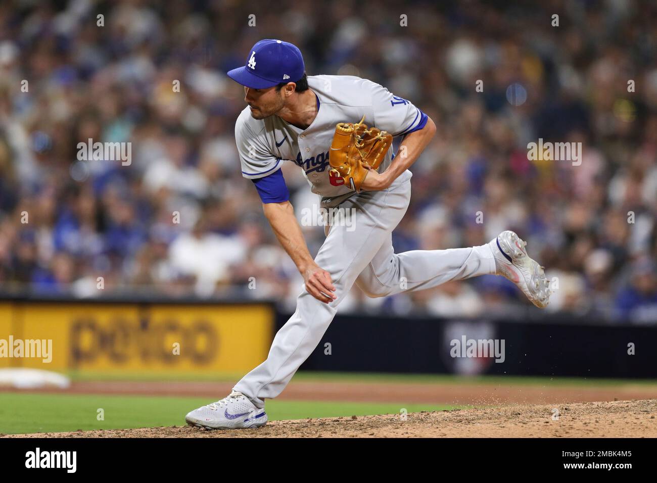 Los Angeles Dodgers relief pitcher Mitch White follows through on a ...