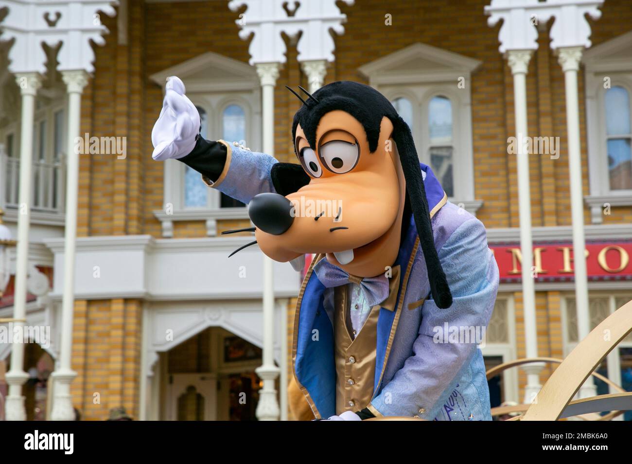 A performer dressed as Goofy entertains parade-goers at Magic Kingdom ...