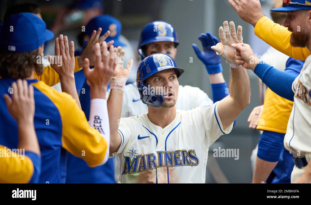 Seattle Mariners' Adam Frazier is congratulated after scoring against ...