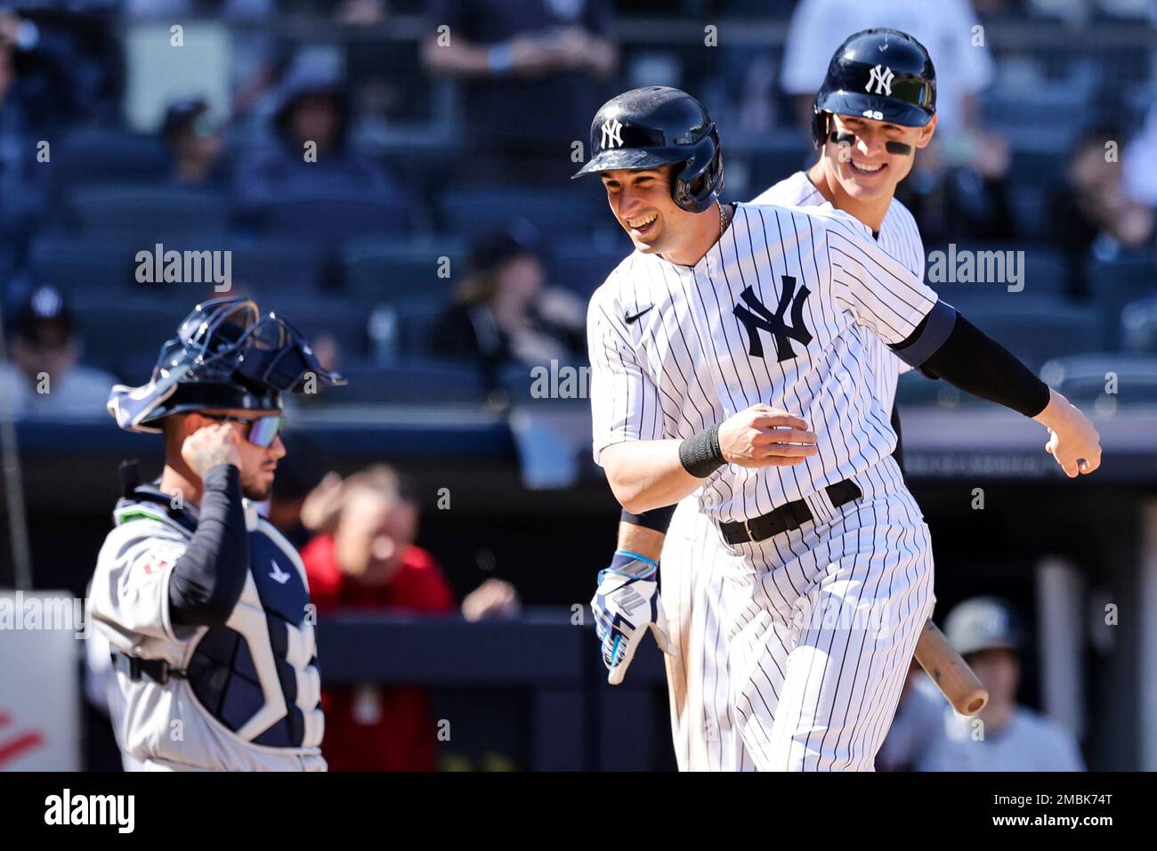 New York Yankees' Tim Locastro, front right, celebrates a home run with ...