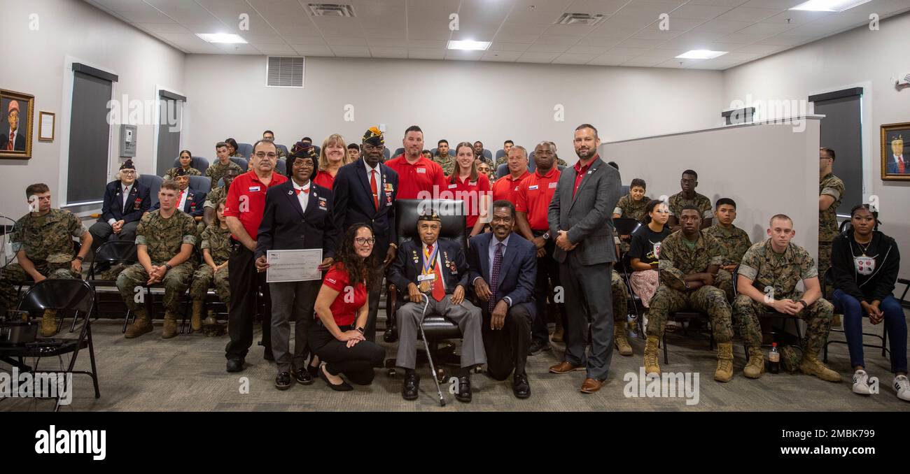 Original Montford Point Marine F.M. Hooper takes part in a group photo ...