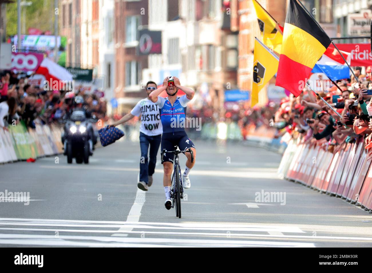 Belgium's Remco Evenepoel of the Quickstep Alpha Vinyl team reacts as ...