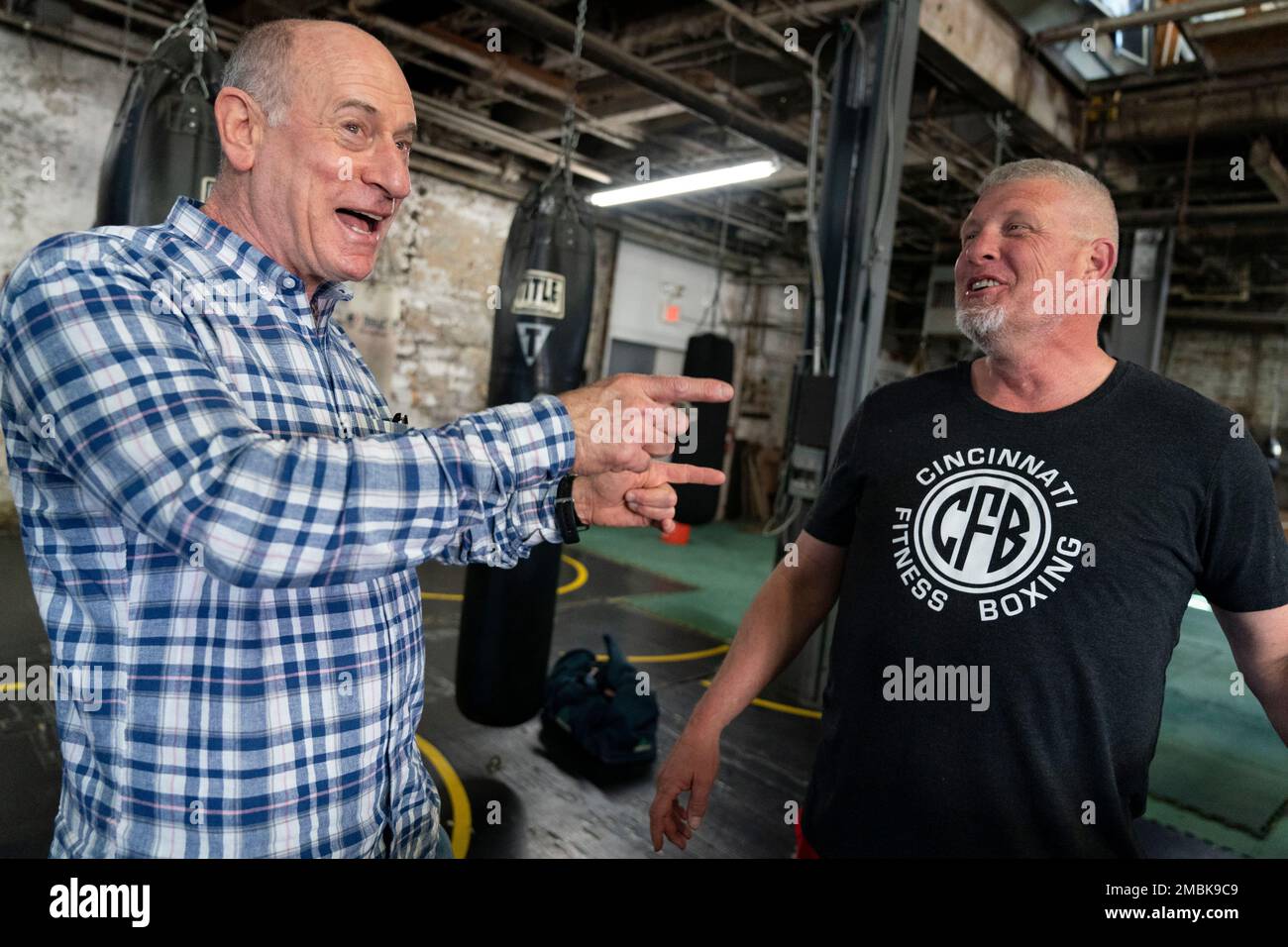 Ohio Congressional candidate Phil Heimlich, left, speaks with patrons ...