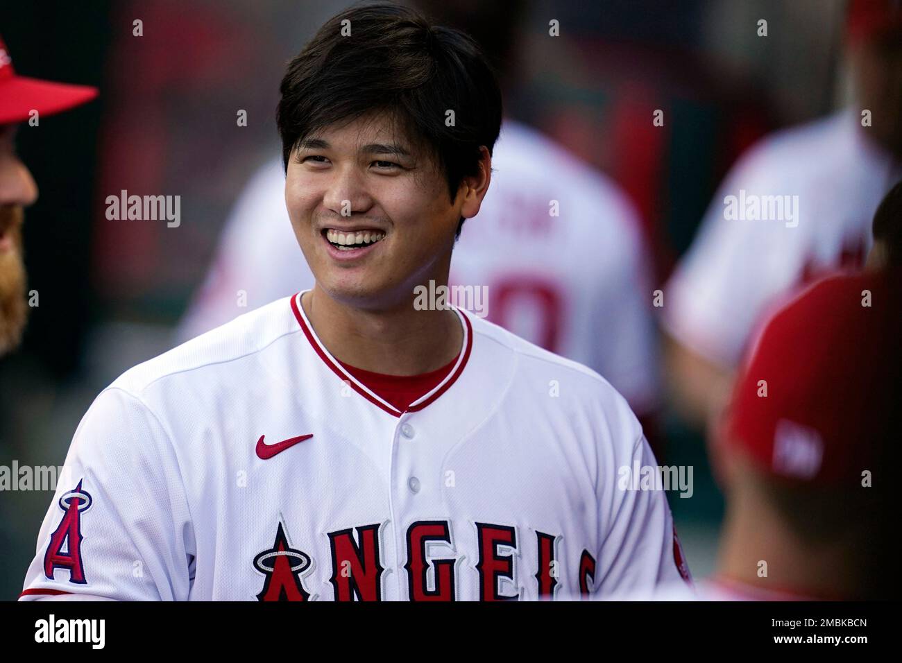 Los Angeles Angels' Shohei Ohtani smiles in the dugout before the team ...