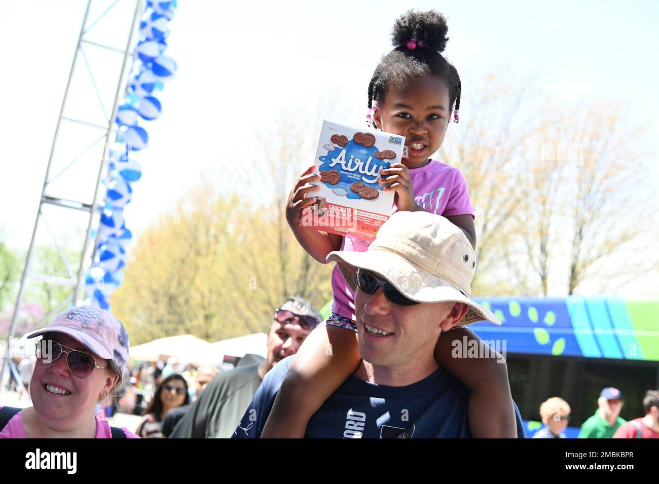 IMAGE DISTRIBUTED FOR AIRLY FOODS - A young girl shows off her box of ...