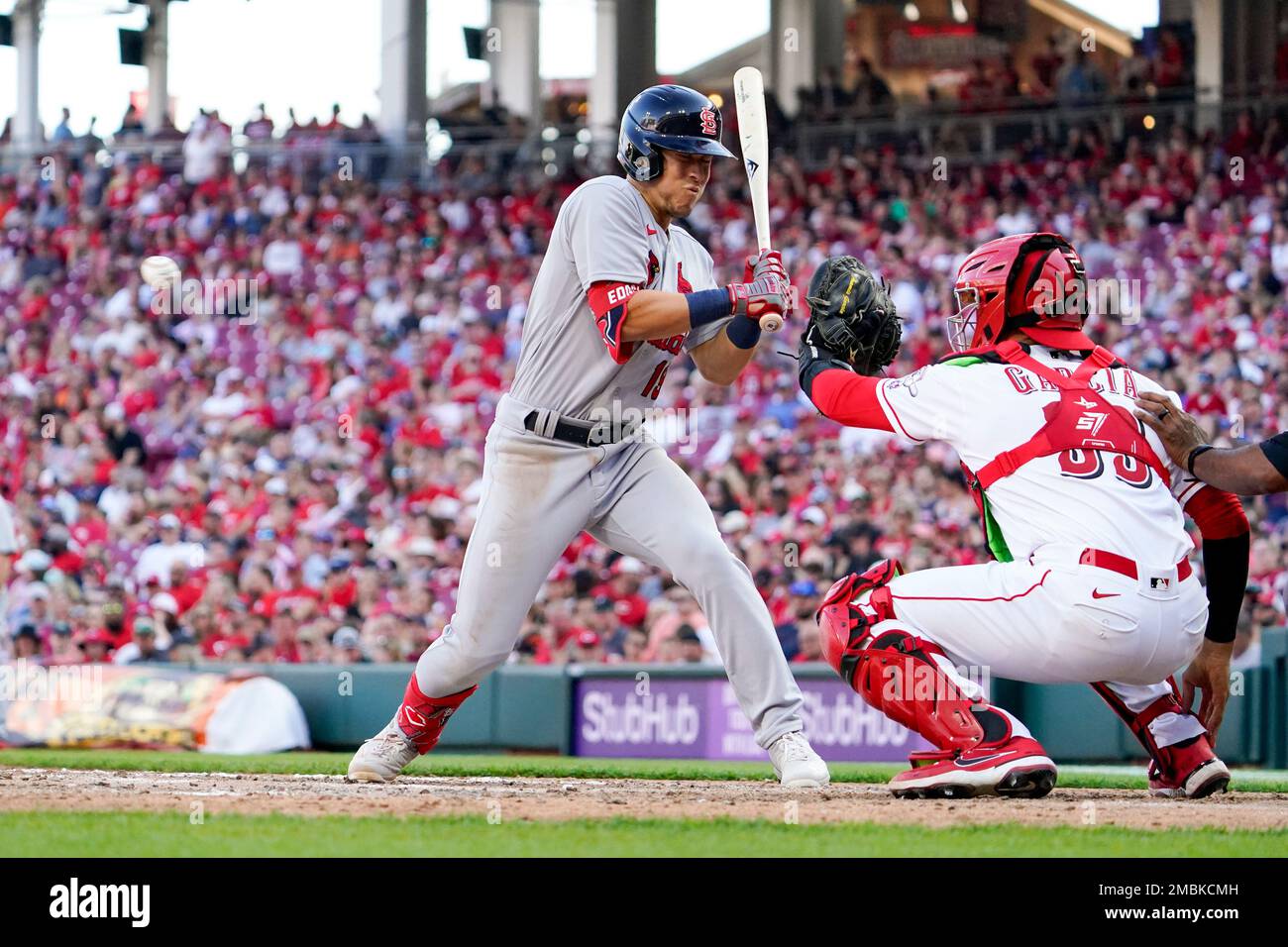 St. Louis Cardinals' Tommy Edman, leftr, is hit by a pitch thrown by ...
